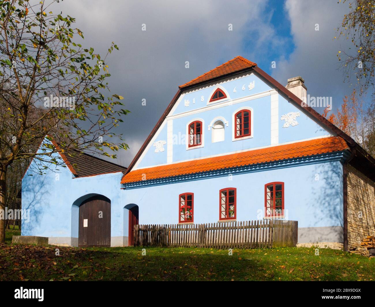 Rural farmhouse with blue facade. Vesely Kopec folk museum. Czech rural ...