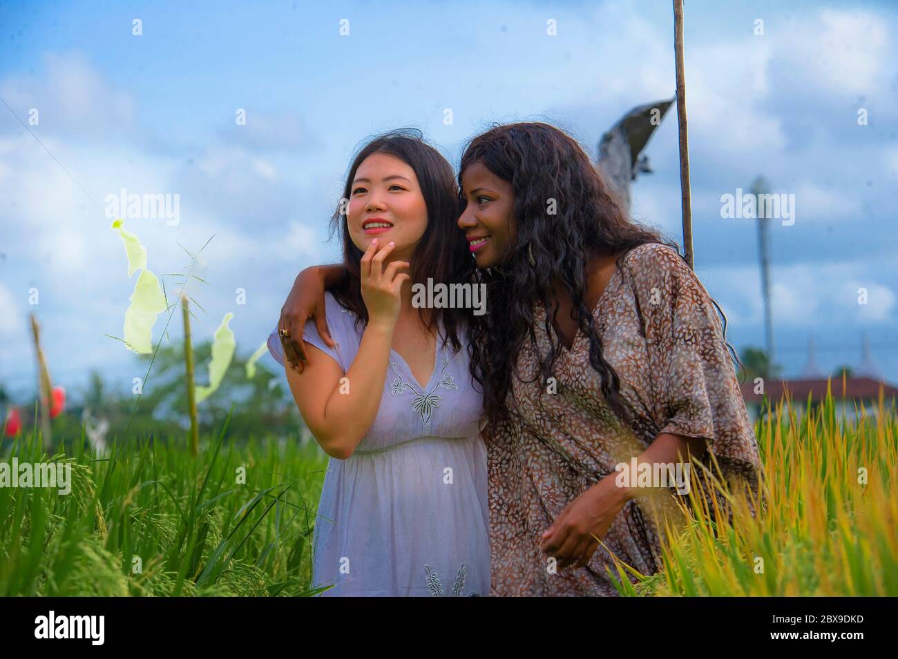 Asian Chinese girl and black African American woman exploring together ...