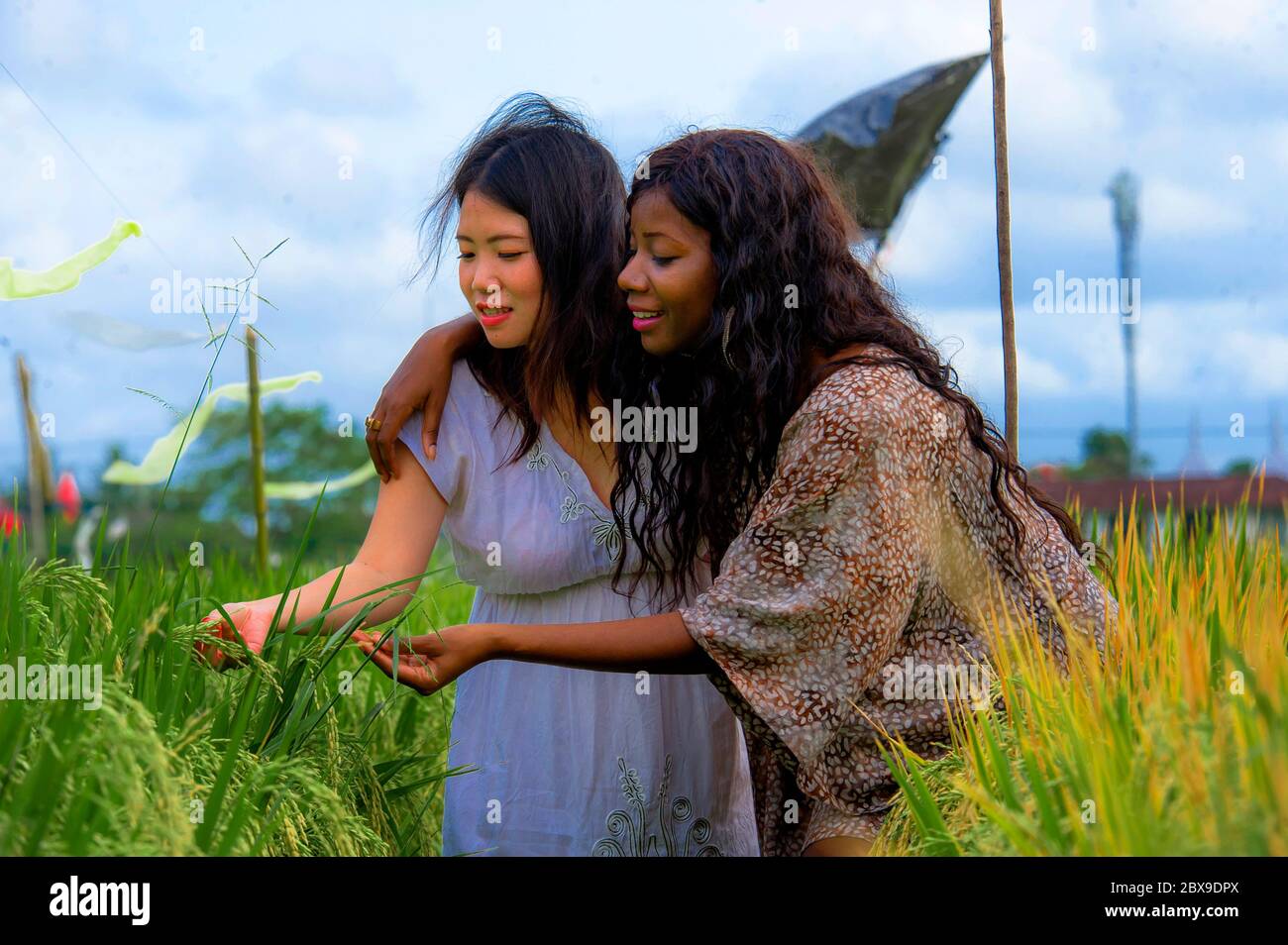 Asian Korean girl and black African American woman exploring together ...