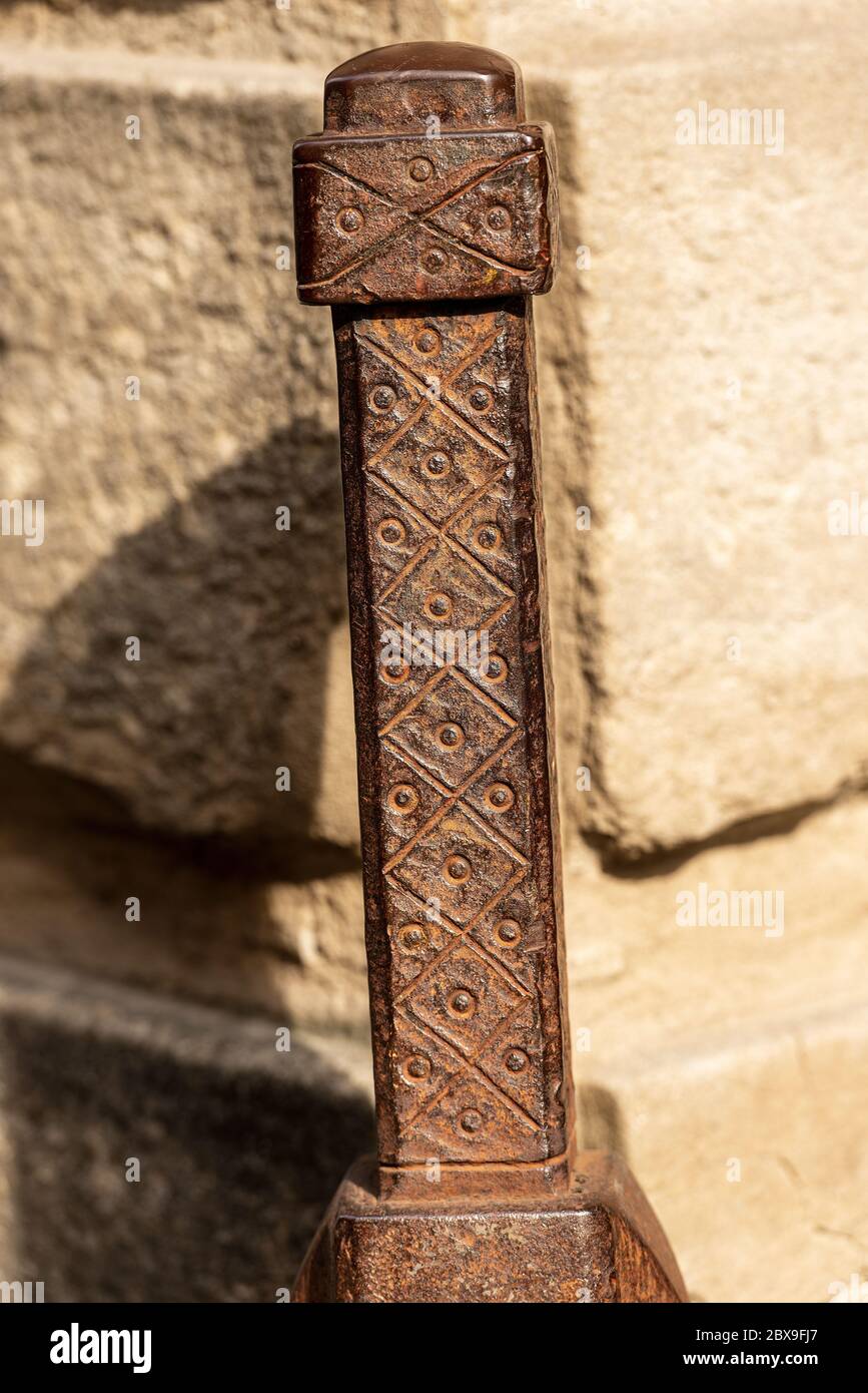 Closeup of an ancient wrought iron bollard to repair the corners of ...