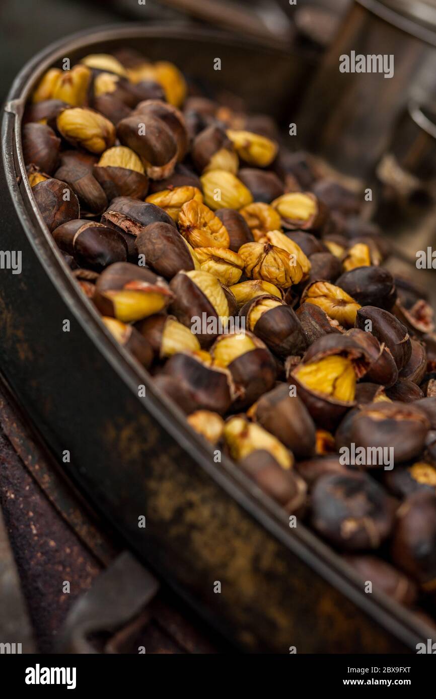 Roasting chestnuts over an open fire. High quality photo Stock Photo ...