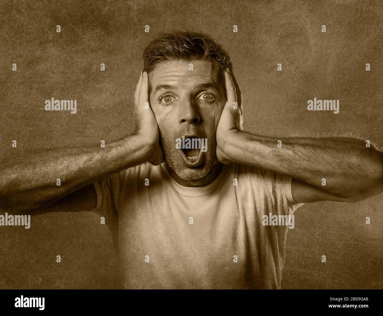 black and white portrait of attractive man in shock and surprised with ...
