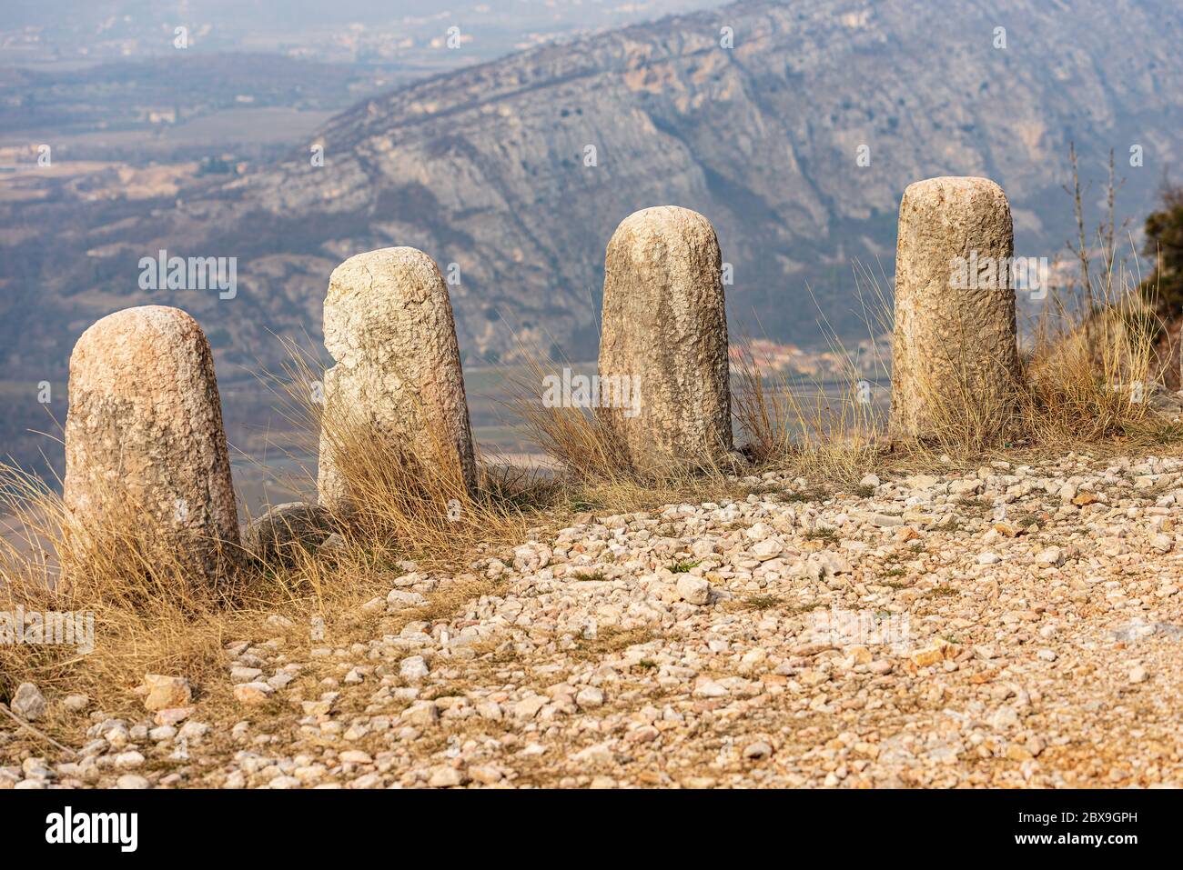 Group of ancient stone bollards placed at the edge of an old Austrian ...