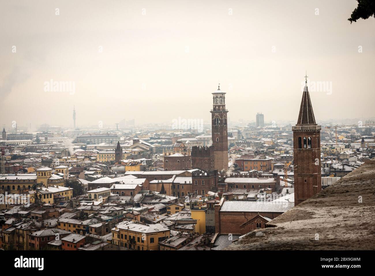 Aerial view of Verona downtown in winter with snow. Church of Santa ...