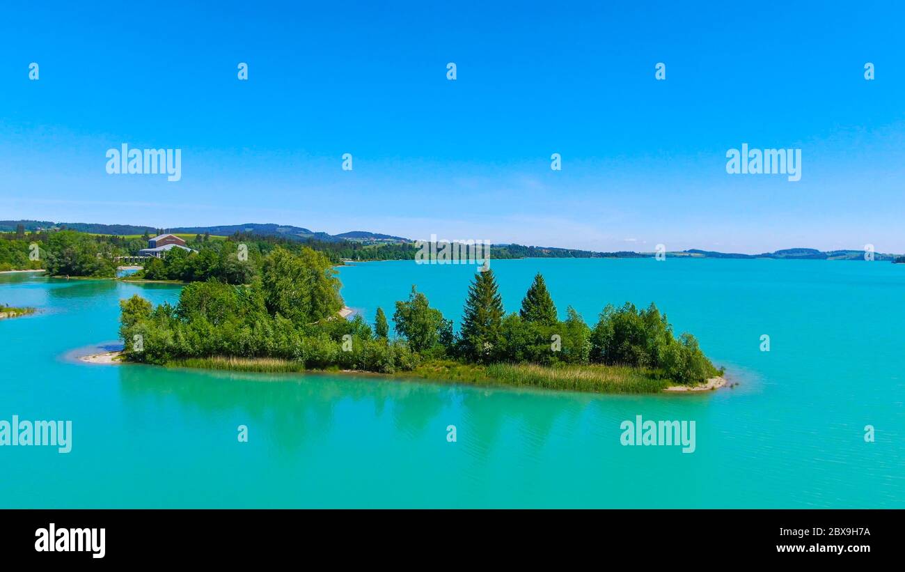 Aerial view over Lake Forggensee at the city of Fuessen in Germany ...
