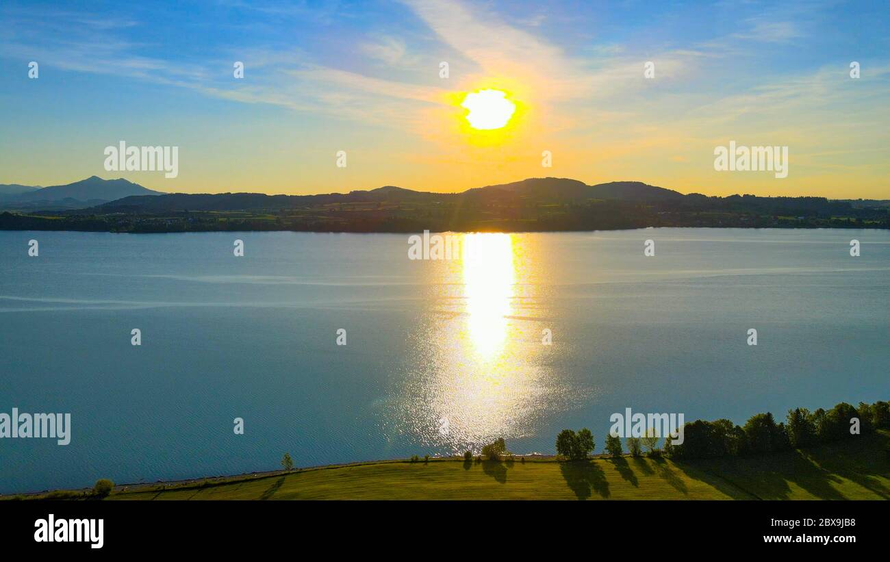 Aerial view over Lake Forggensee at the city of Fuessen in Germany ...