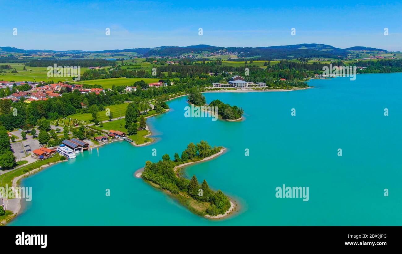 Aerial view over Lake Forggensee at the city of Fuessen in Germany ...