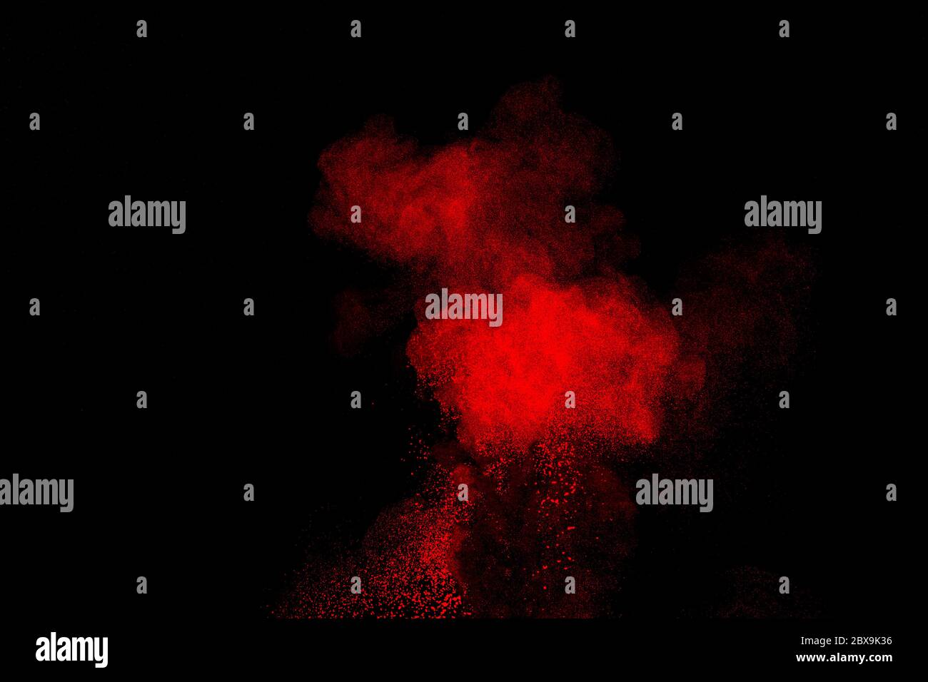 Red particles explosion on black background.Freeze motion of red dust ...