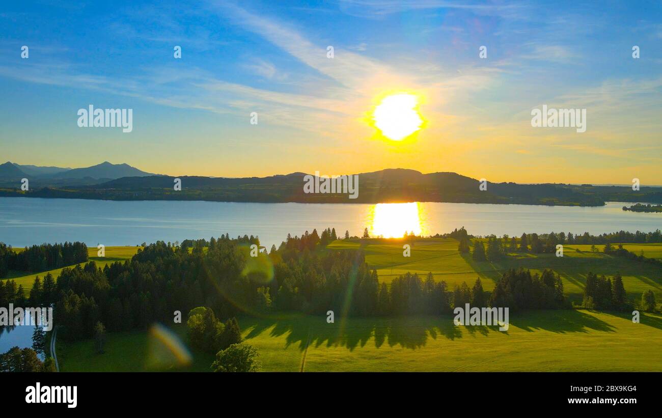 Aerial view over Lake Forggensee at the city of Fuessen in Germany ...