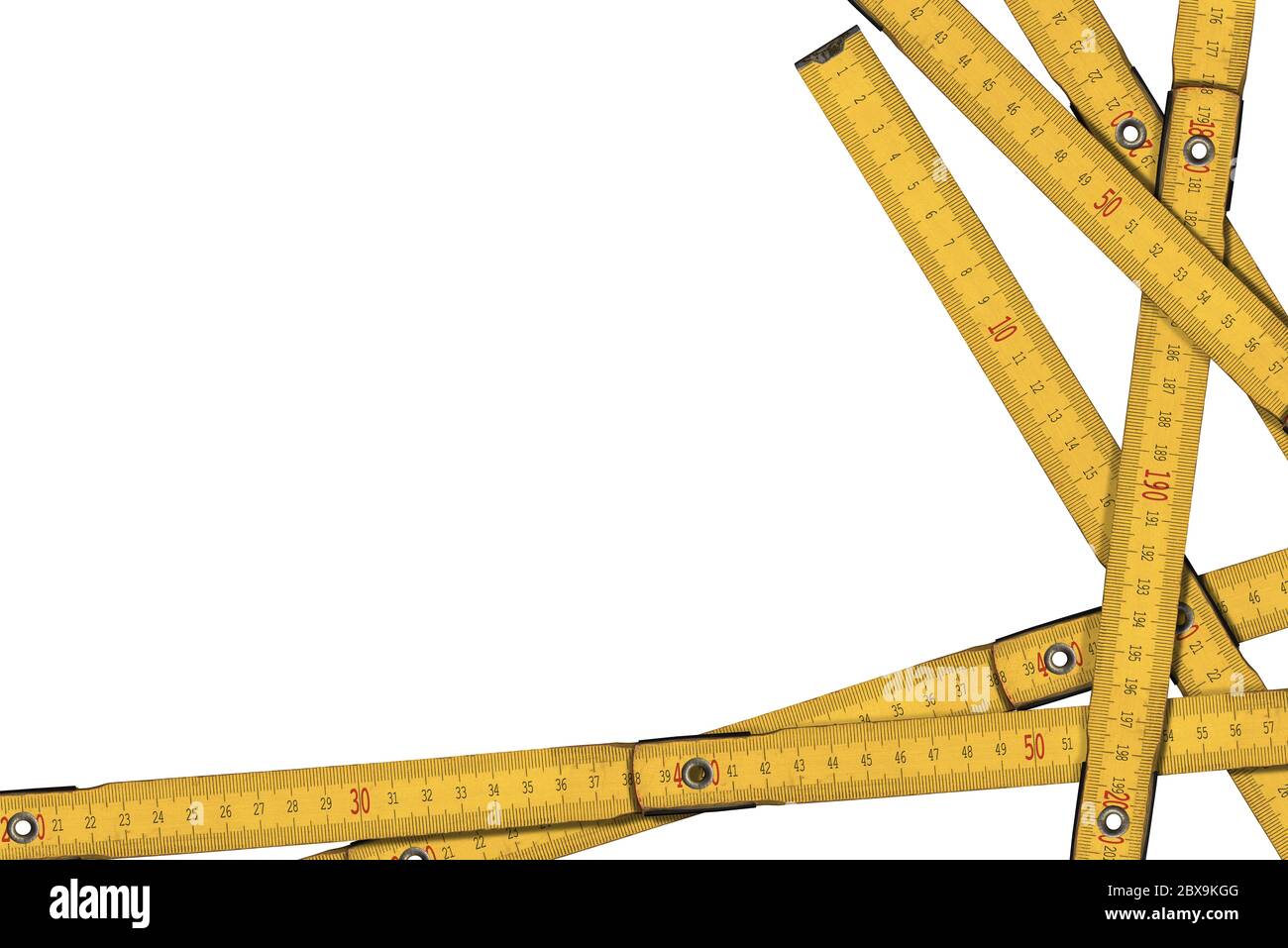 Close-up of old yellow folding wooden rulers isolated on white ...