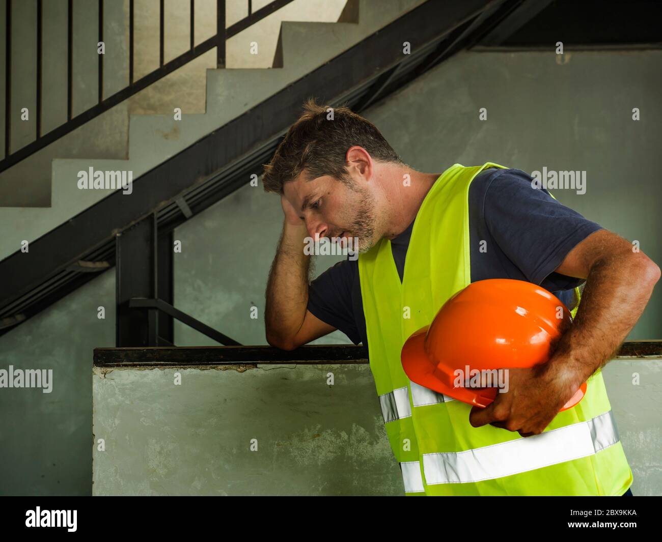 problem at the building site. Attractive stressed and frustrated ...
