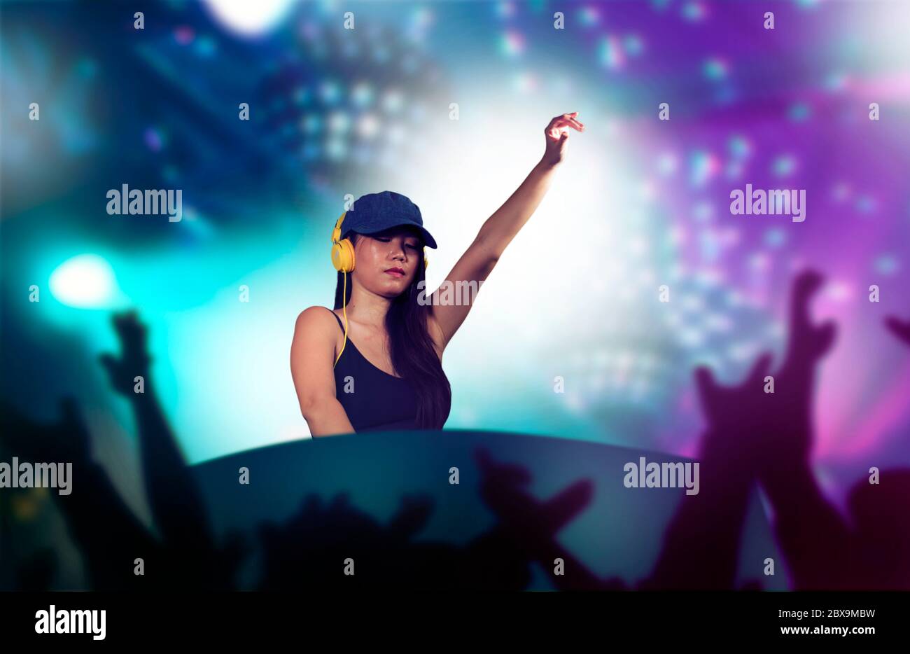 young attractive and cool Asian Korean DJ woman with headphones at ...