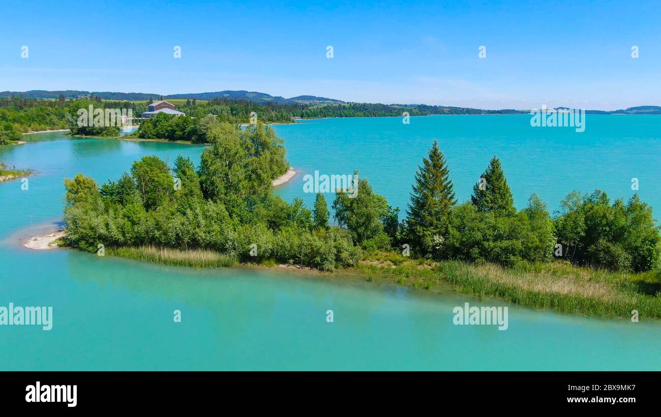 Aerial view over Lake Forggensee at the city of Fuessen in Germany ...