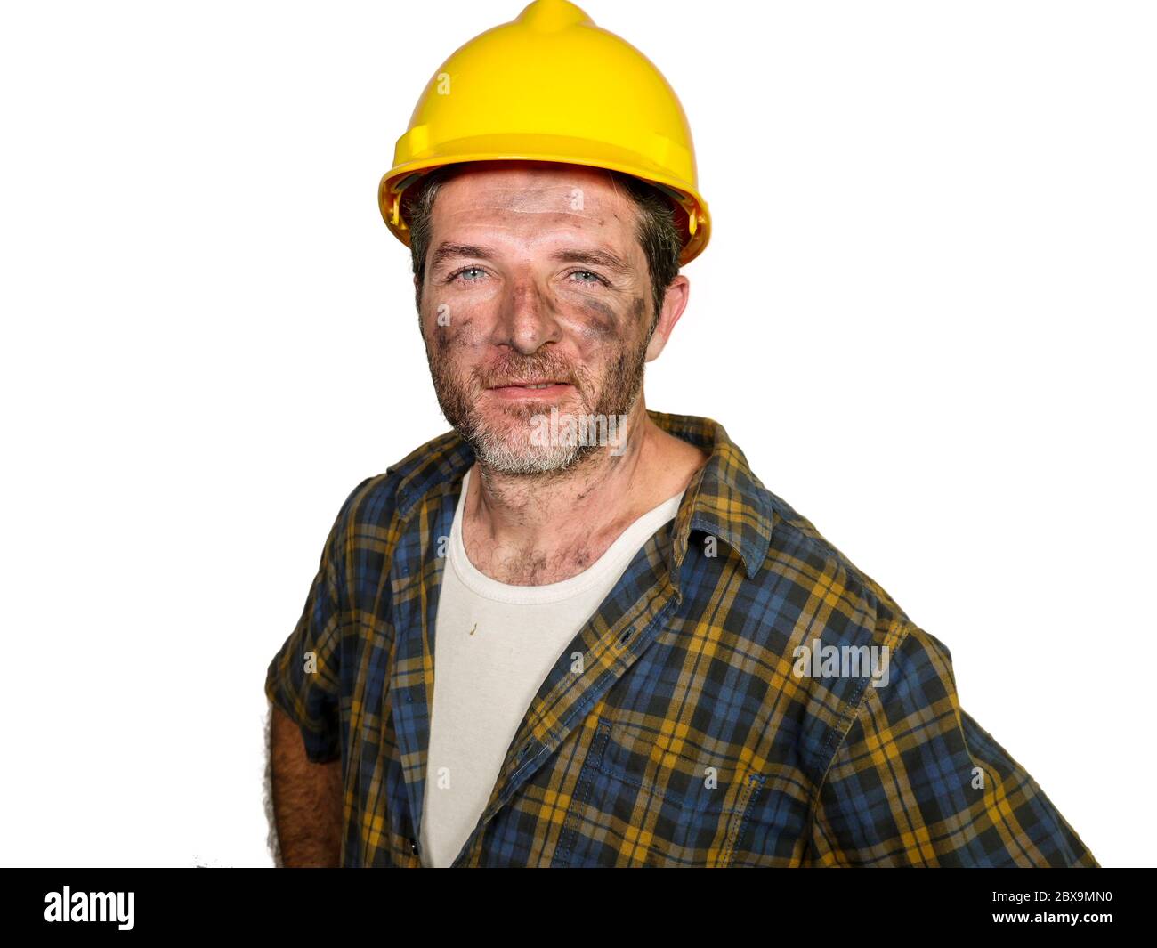 corporate portrait of construction worker. Attractive and happy builder man in safety helmet ...