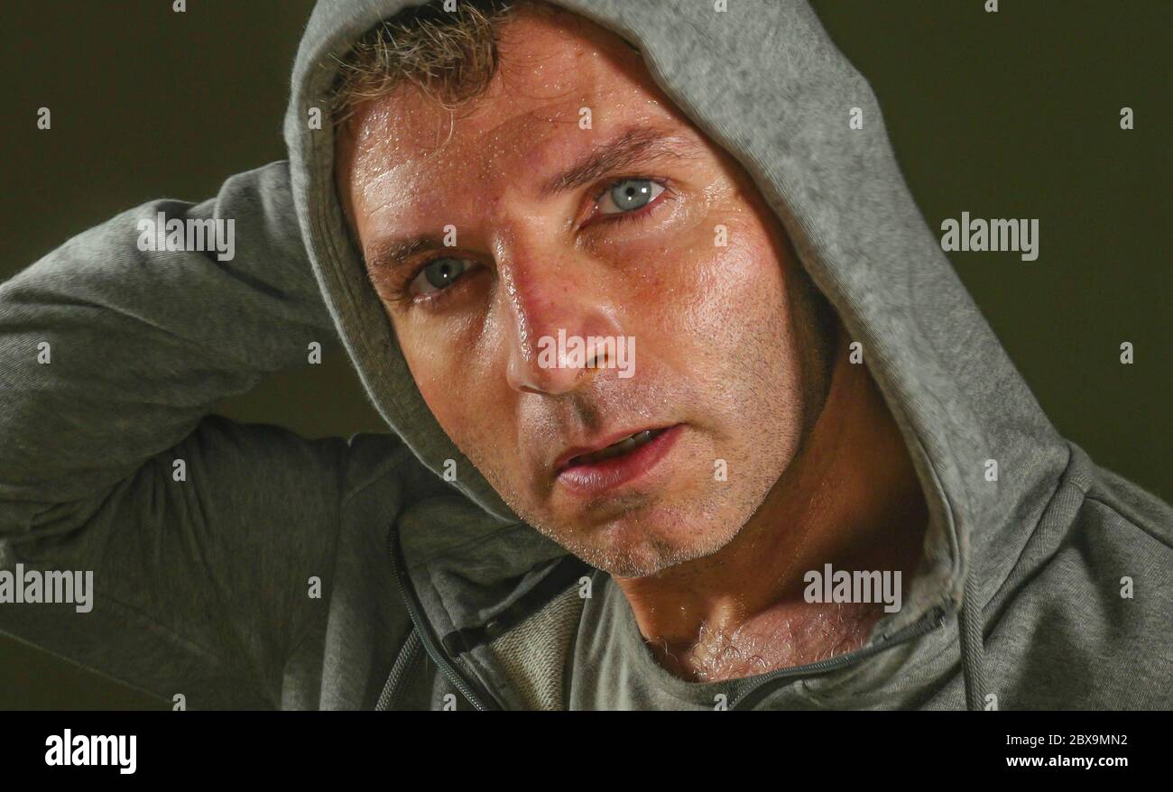 close up sweaty face portrait of young attractive and fierce looking ...
