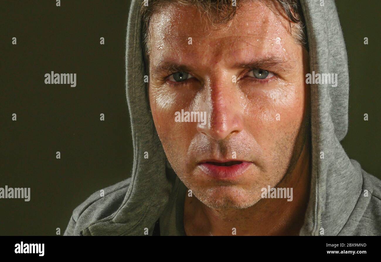 close up sweaty face portrait of young attractive and fierce looking ...