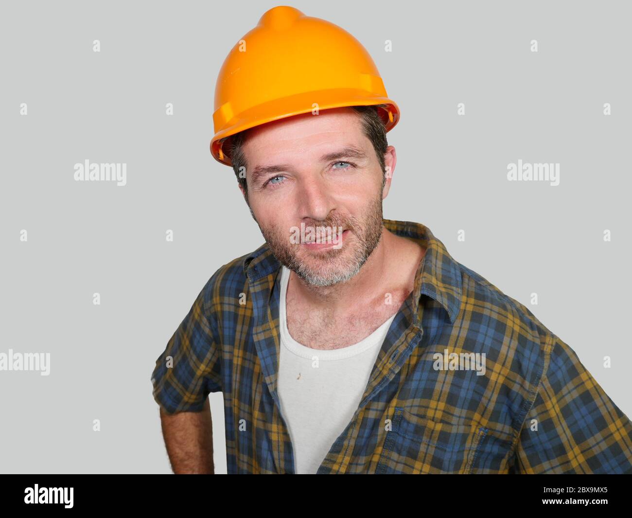 corporate portrait of construction worker. Handsome and confident ...
