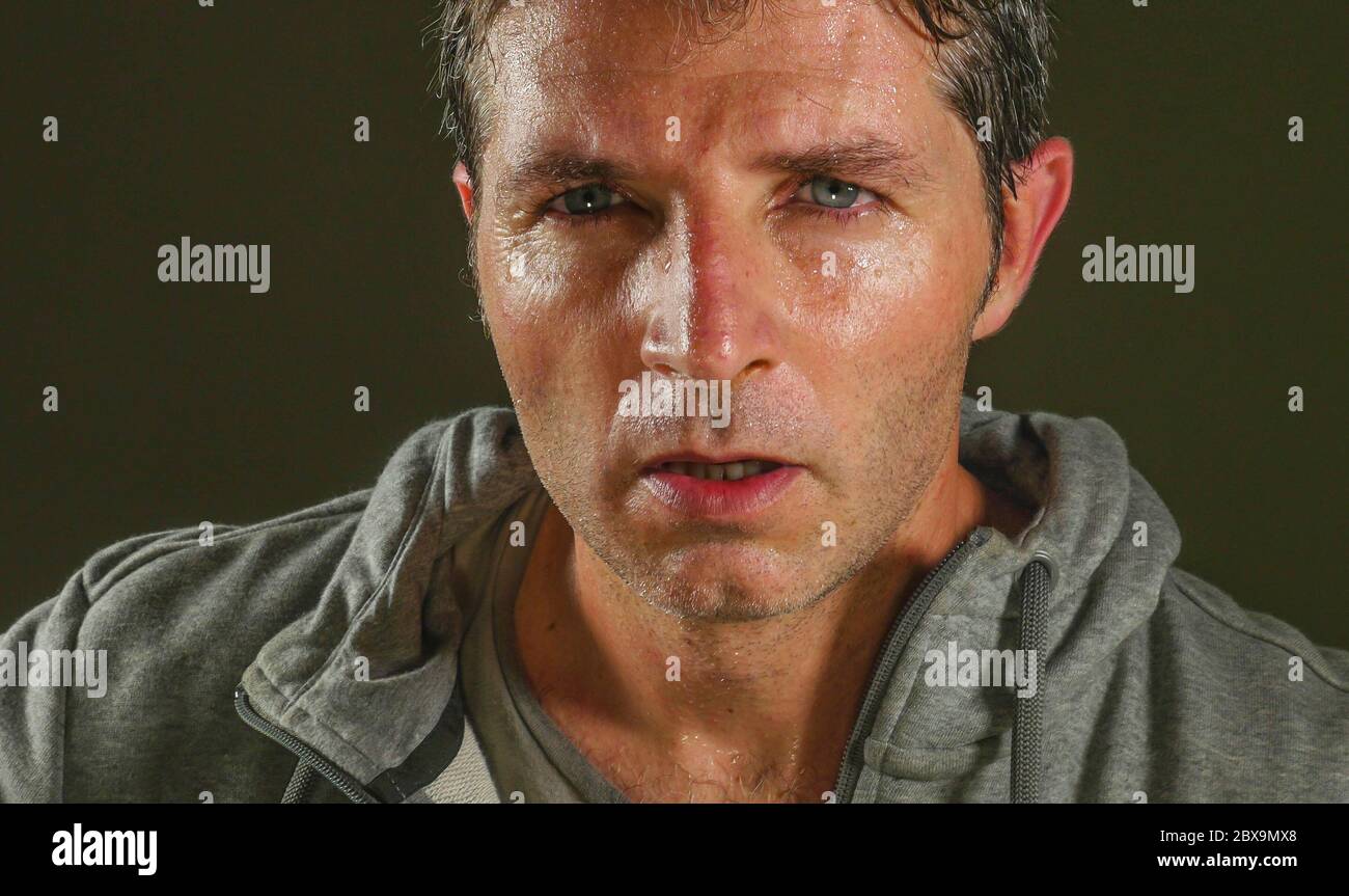 close up sweaty face portrait of young attractive and fierce looking ...