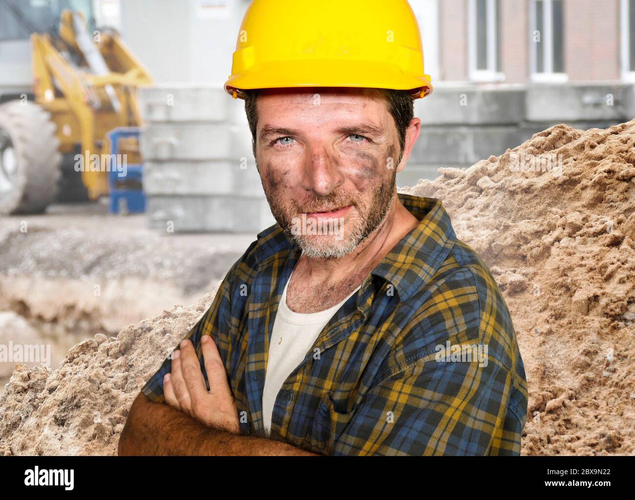 lifestyle portrait of young attractive and confident contractor or ...