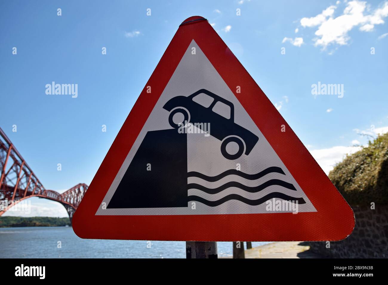Close up of warning triangle sign for car falling into water with ...