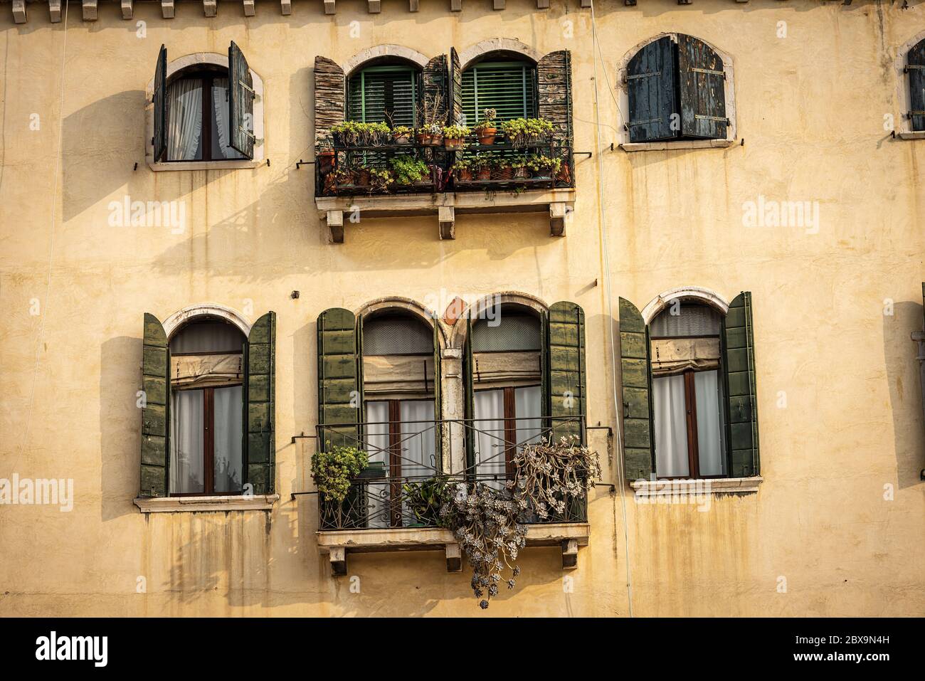 Venice downtown, close-up of an old house with windows and balconies ...