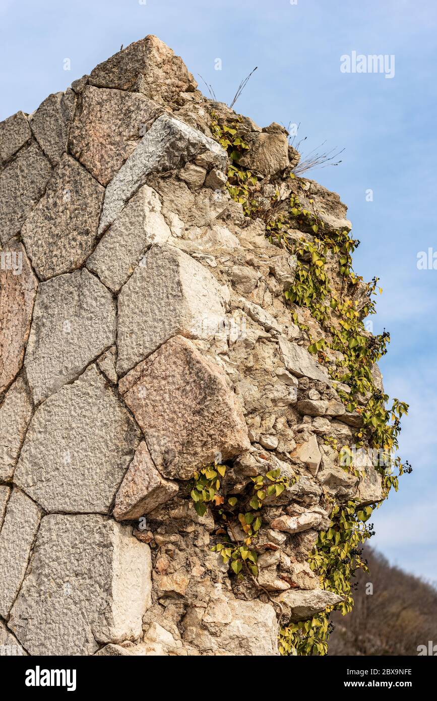Close-up of old ruin of an Austrian fortified wall made of stone blocks ...