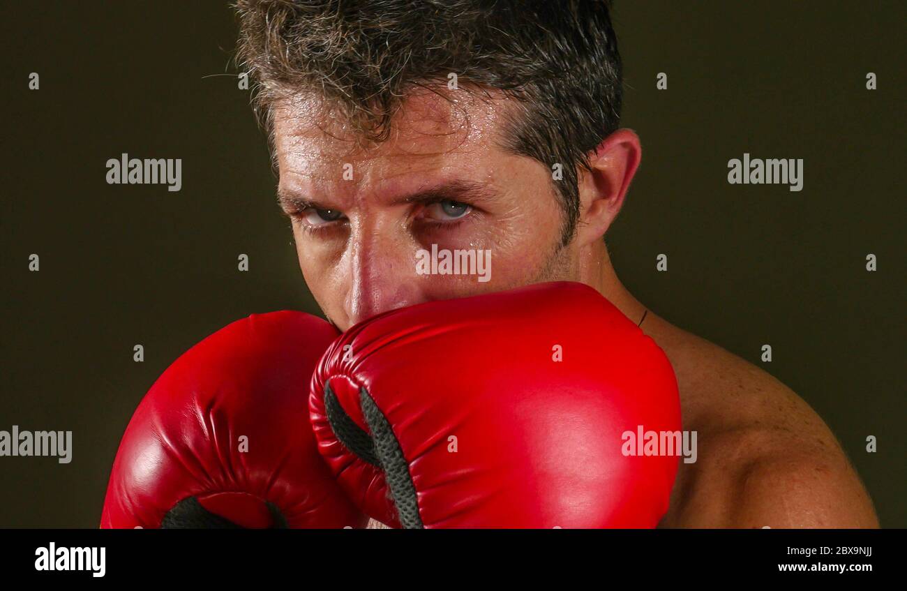 close up face portrait of young attractive and fierce looking man in ...