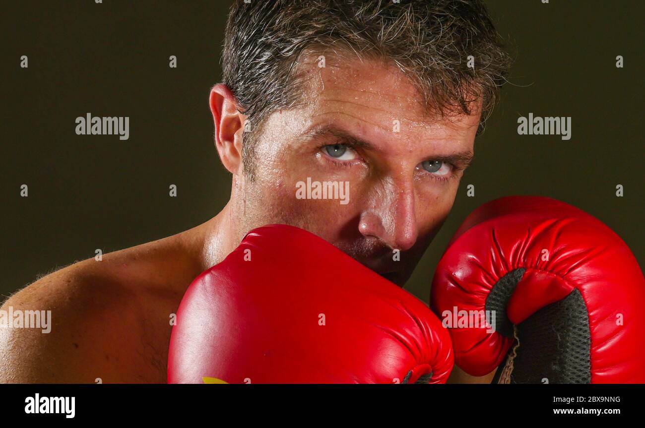 close up face portrait of young attractive and fierce looking man in ...