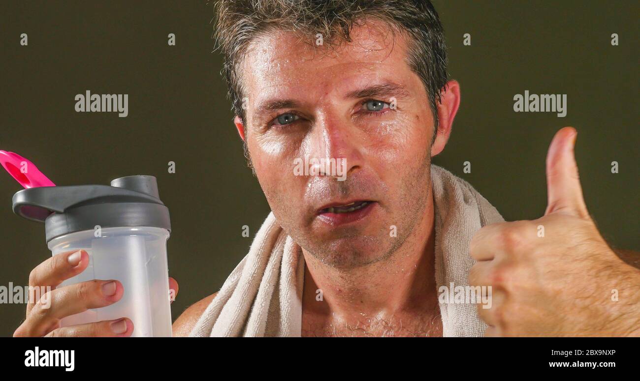 young attractive and handsome sport man sweating after gym workout ...