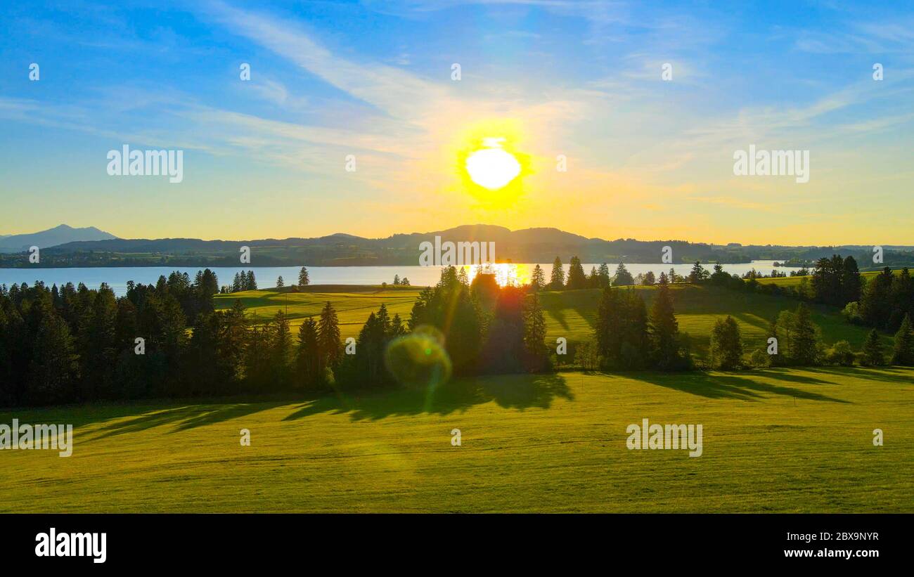 Aerial view over Lake Forggensee at the city of Fuessen in Germany ...