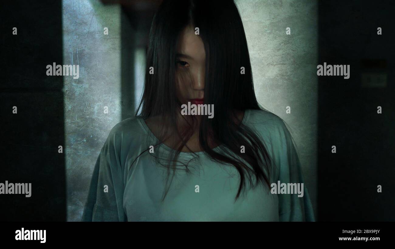 Japanese horror movie style portrait of young strange Asian girl at ...