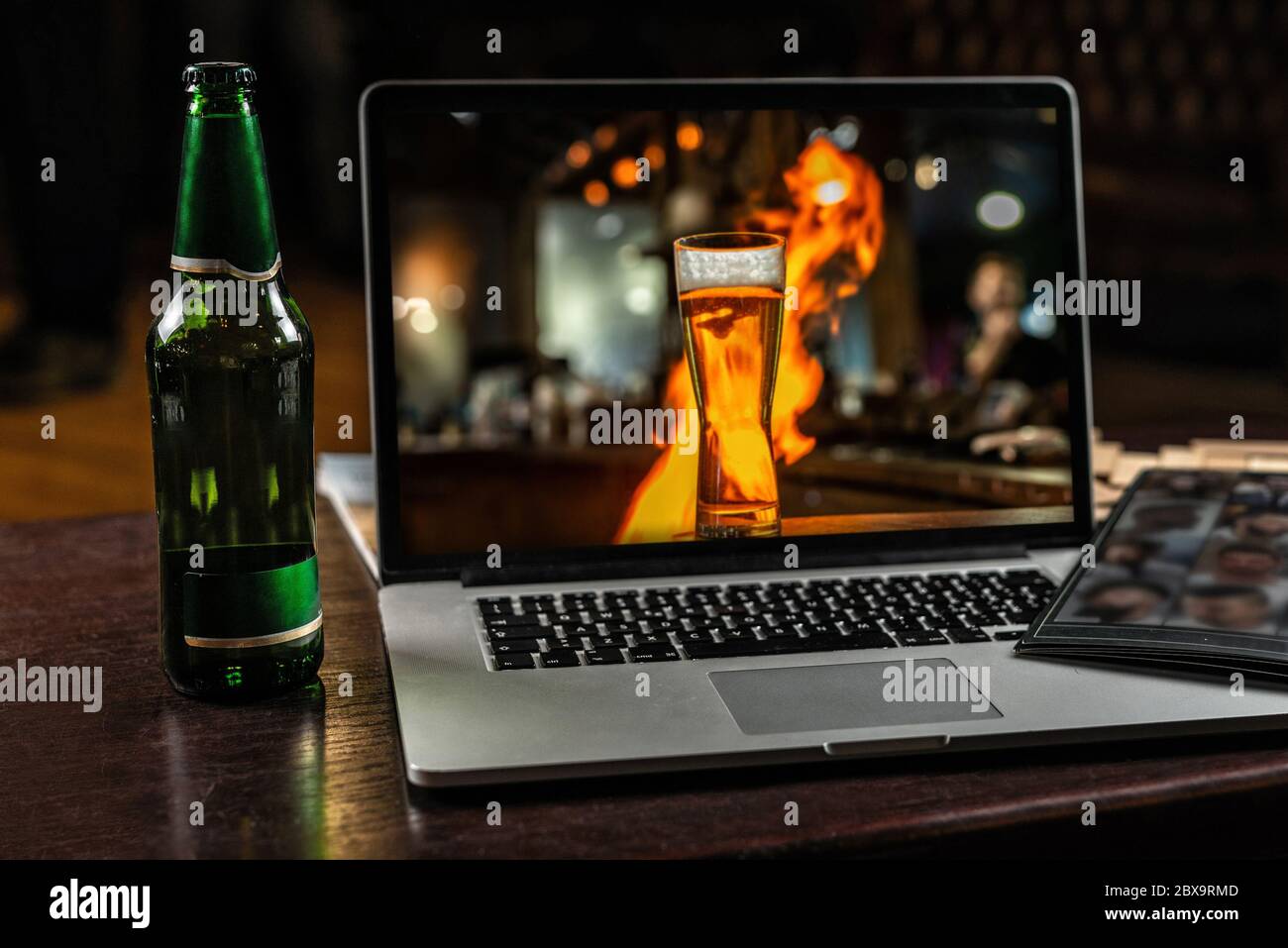 a bottle of light lager beer on the desktop with an open laptop, beer ...