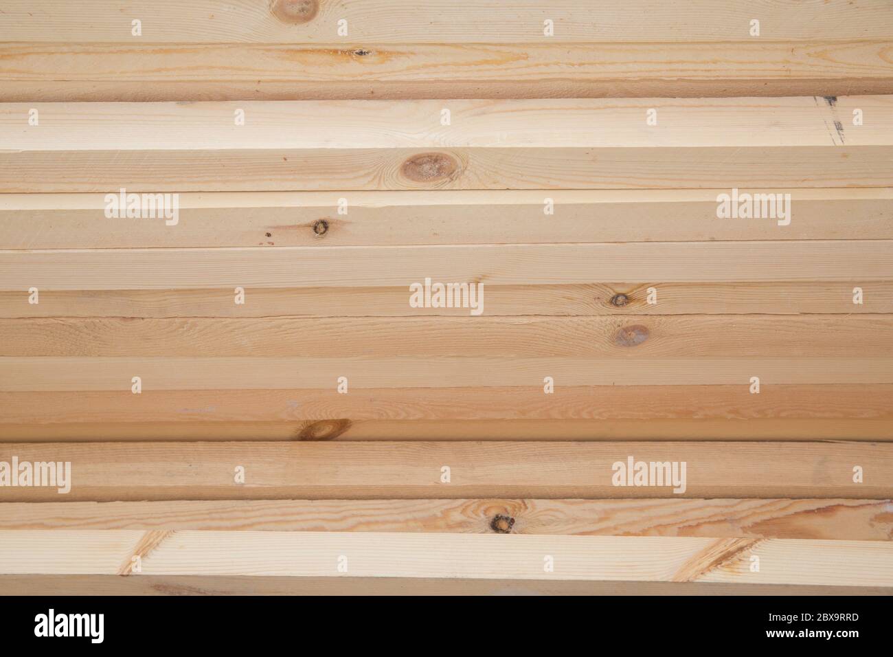 Timber industry objects. Finished wood beams or plank at a warehouse ...
