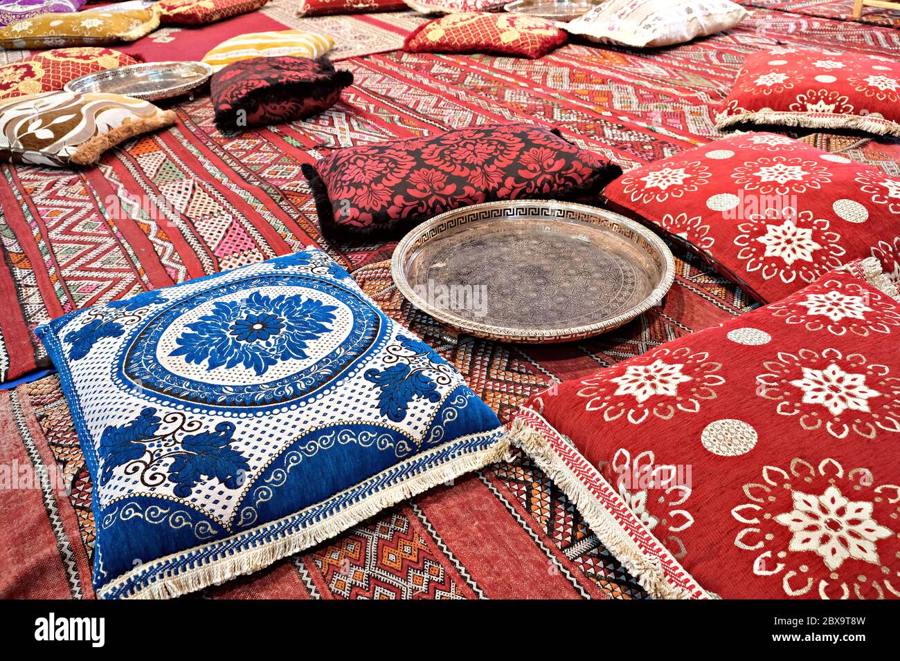 View of the floor of an Arabic tea room with carpets and cushions Stock ...