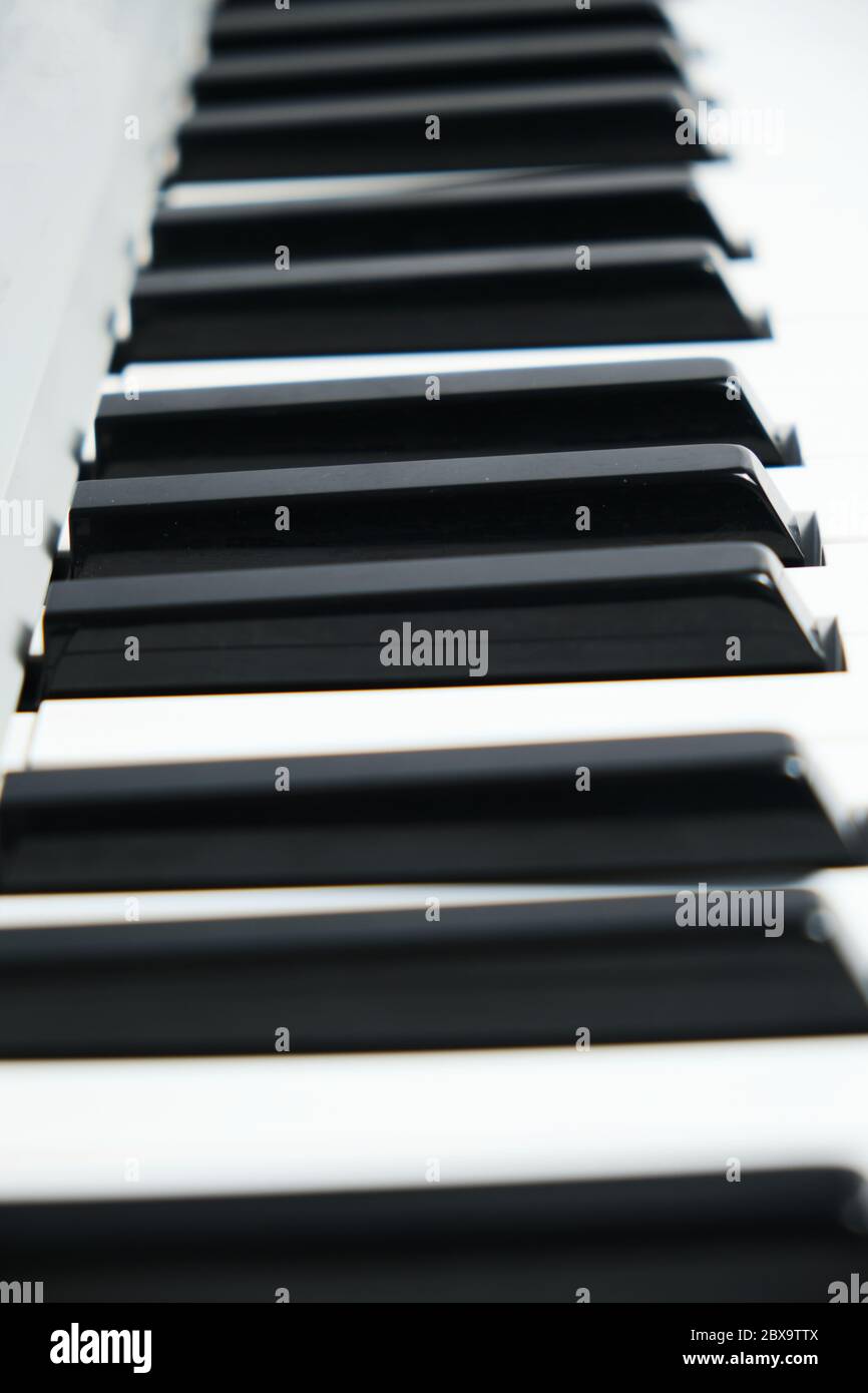 Black and white keys from the piano and synthesizer Stock Photo - Alamy