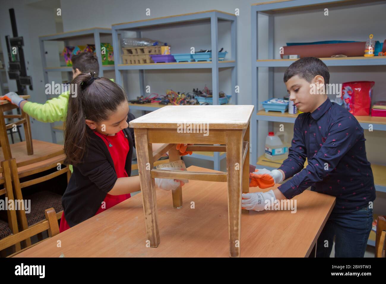Children clean the table to paint . Azerbaijan Baku 17.05.2020 Stock ...