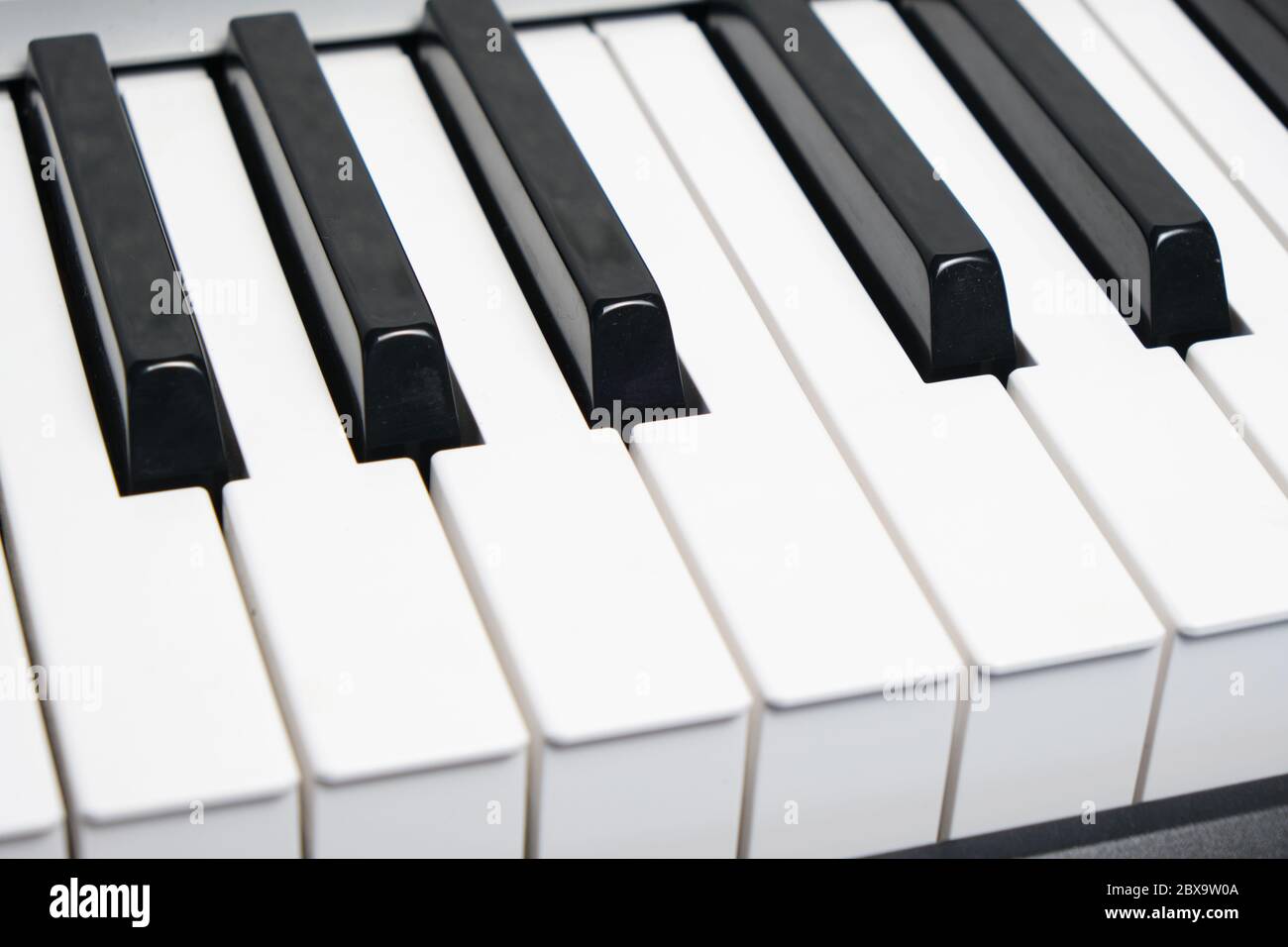 Black and white keys from the piano and synthesizer Stock Photo - Alamy