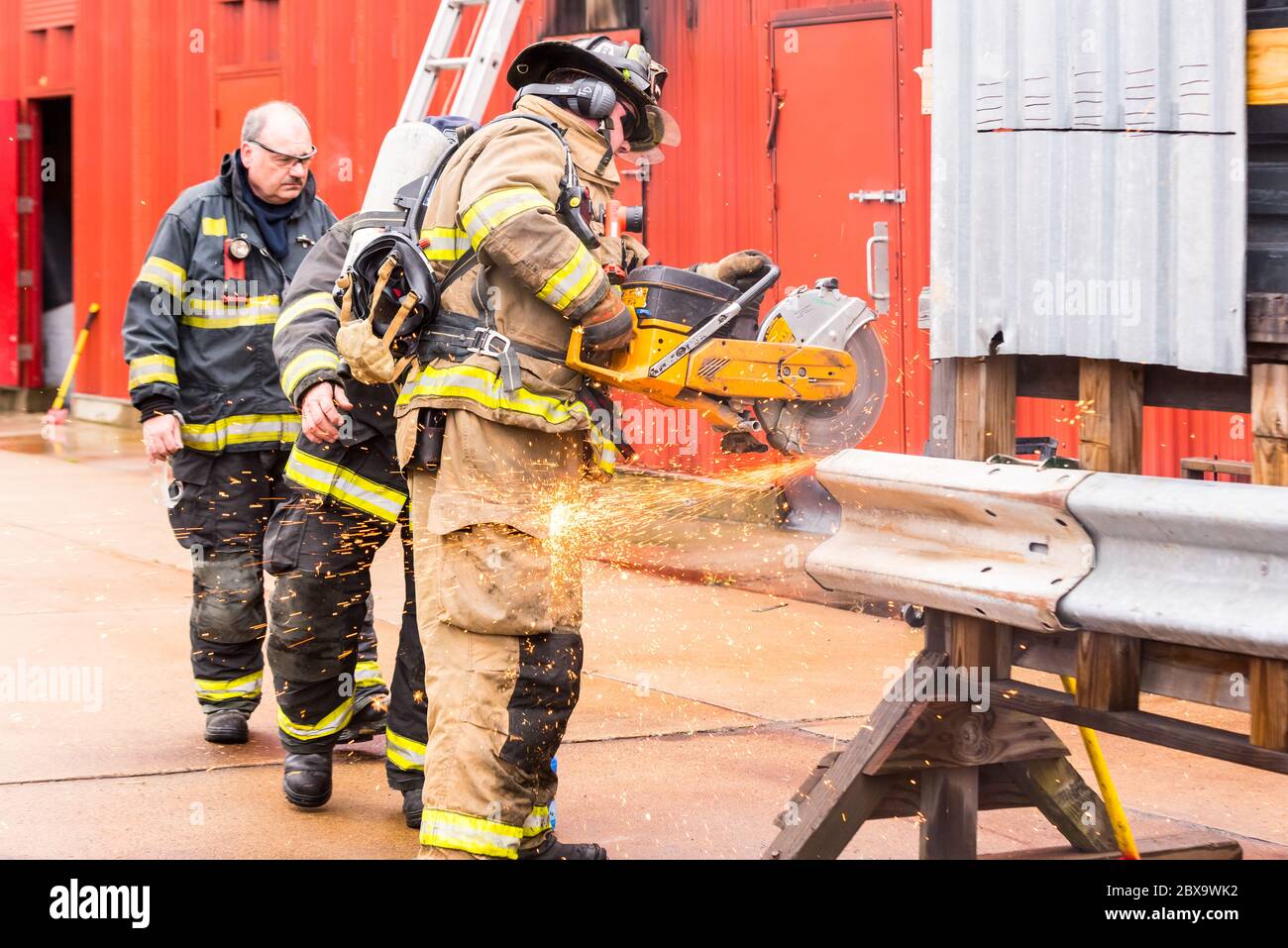 Firefighter learning the proper way to cut metal, using a highway ...