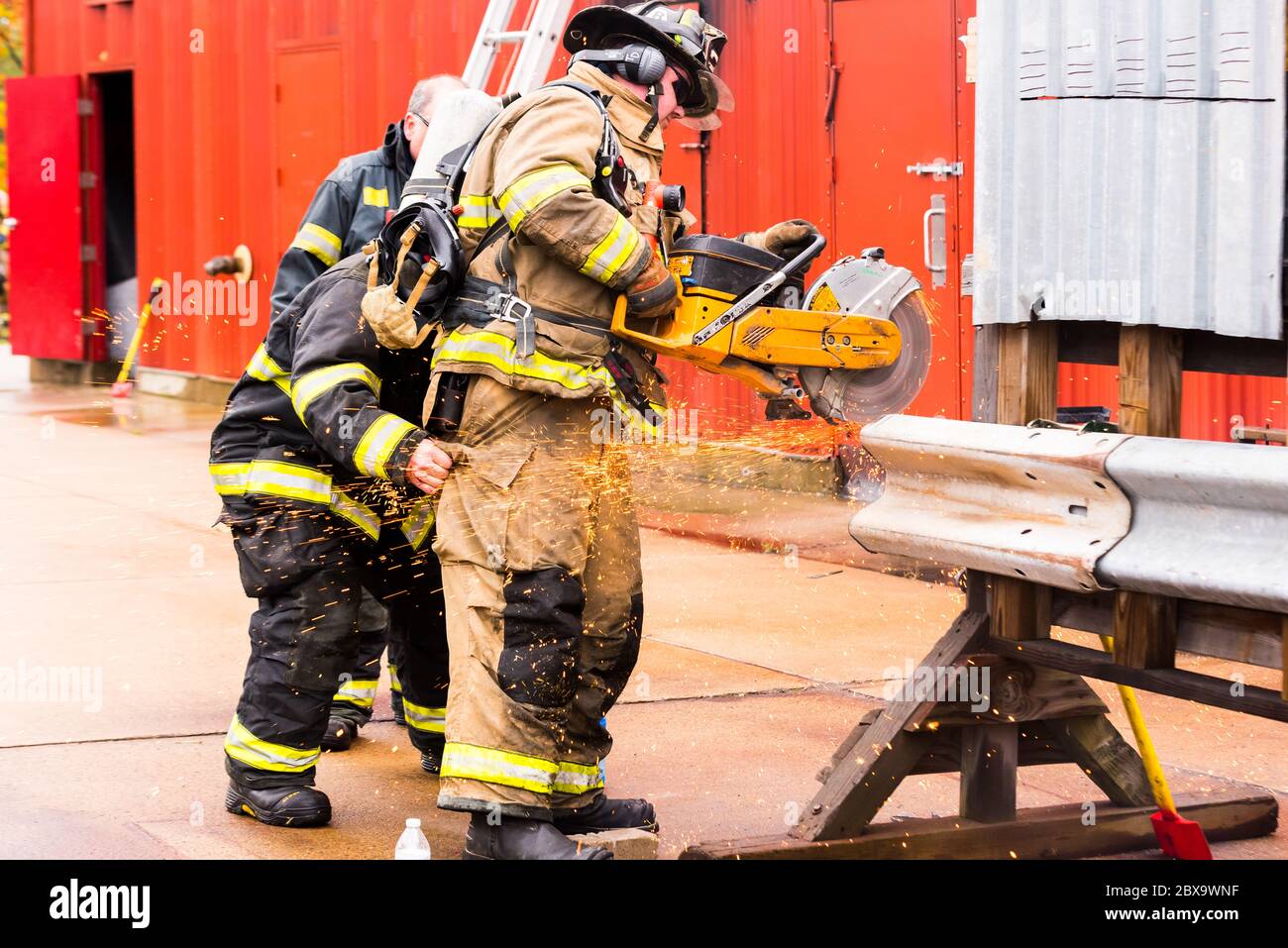 Firefighter learning the proper way to cut metal, using a highway ...