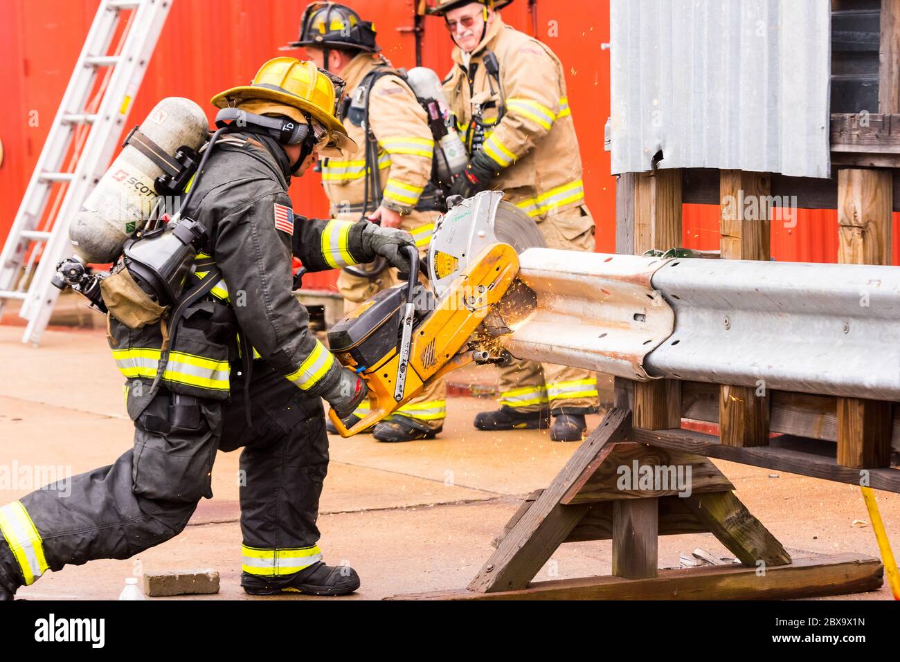 Firefighter learning the proper way to cut metal, using a highway ...