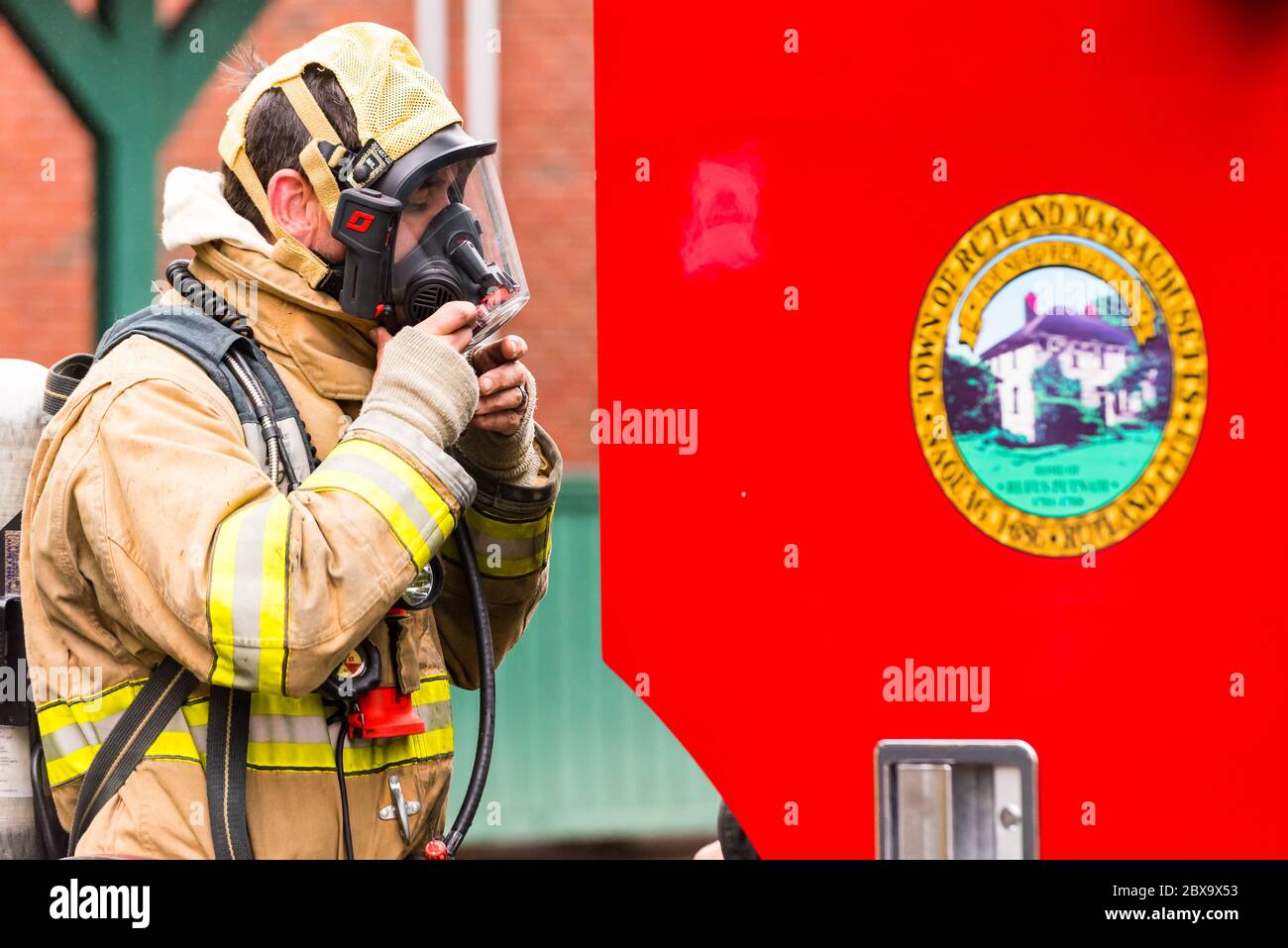 Firefighter adjusting his oxygen mask during training at the Worcester ...