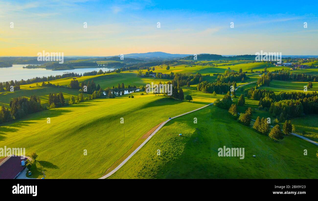 Aerial view over Lake Forggensee at the city of Fuessen in Germany ...