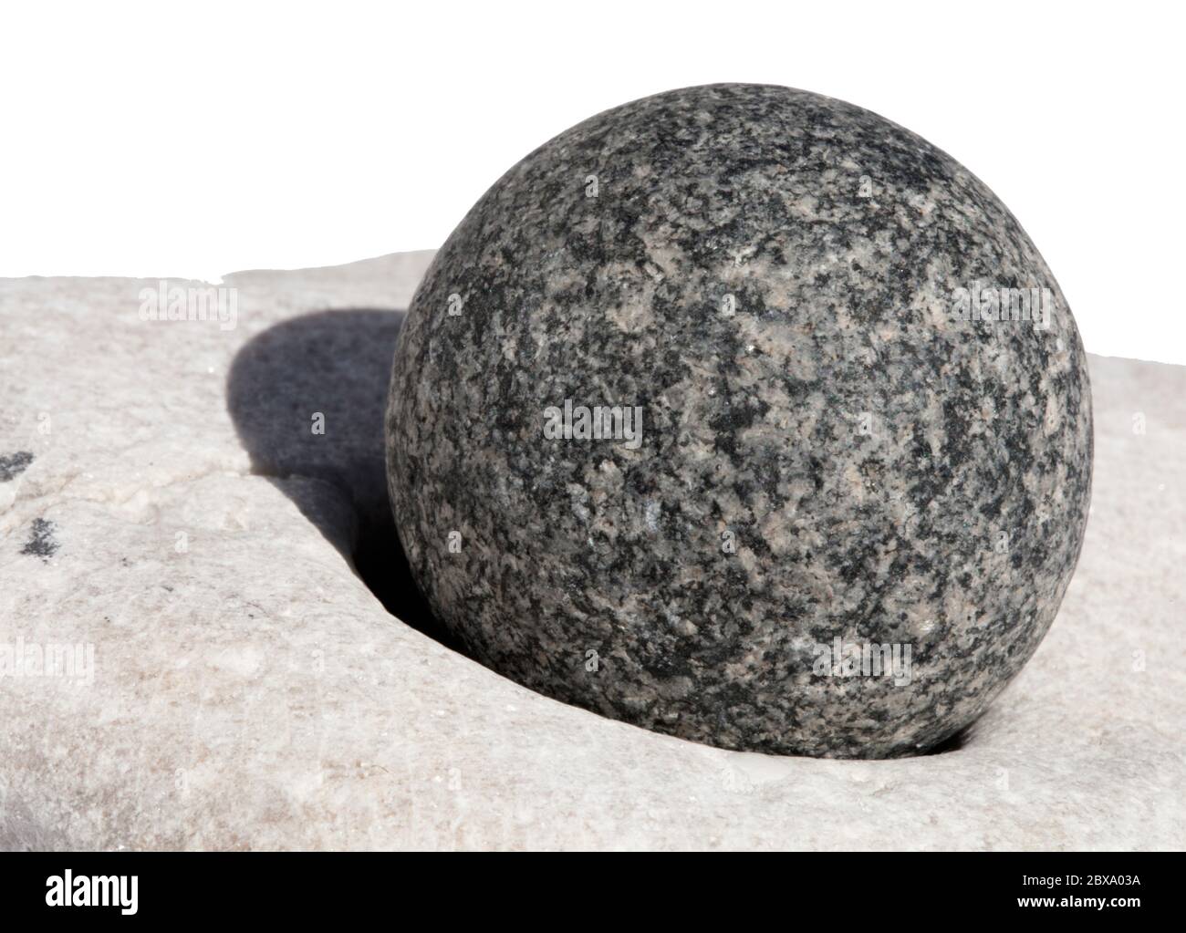 Granite stone spherical, round in a hole. Black and white pattern Stock ...