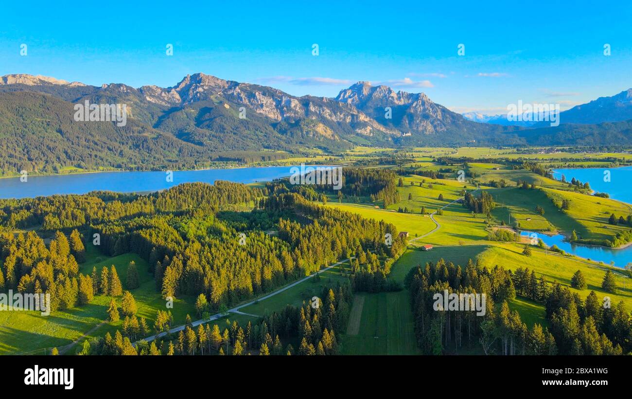 Aerial view over Lake Forggensee at the city of Fuessen in Germany ...