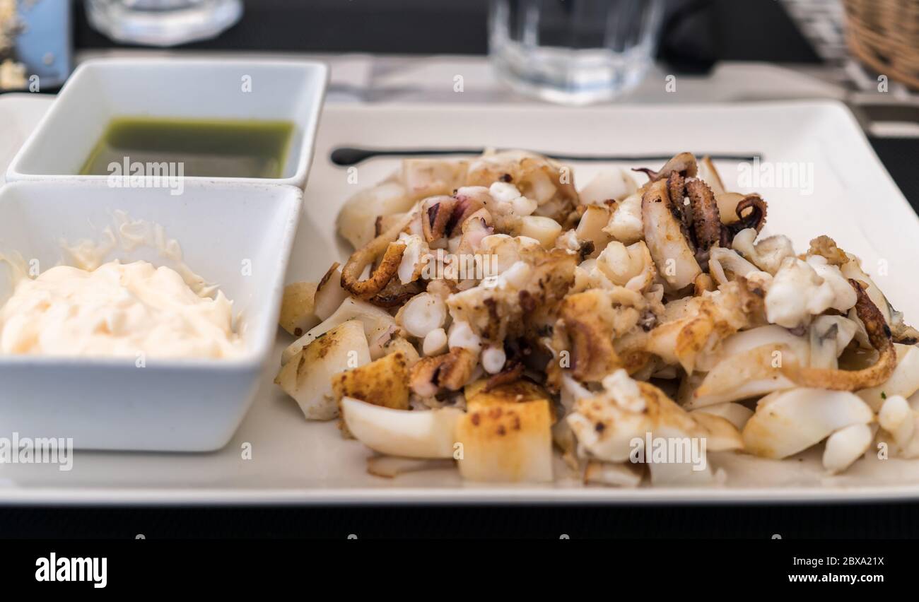 Grilled squid, grilled cuttlefish served as a Spanish sepia tapa with ...