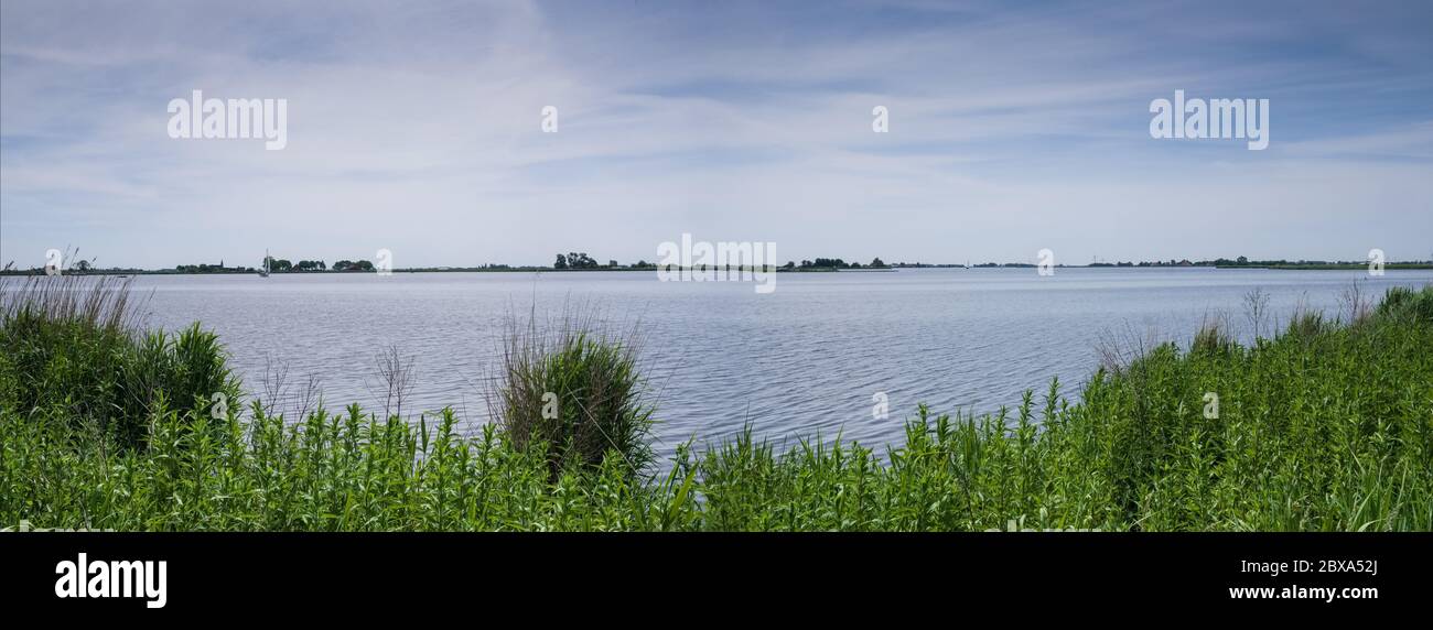 Widescreen photo of typical landscape with lakes in the Dutch province ...
