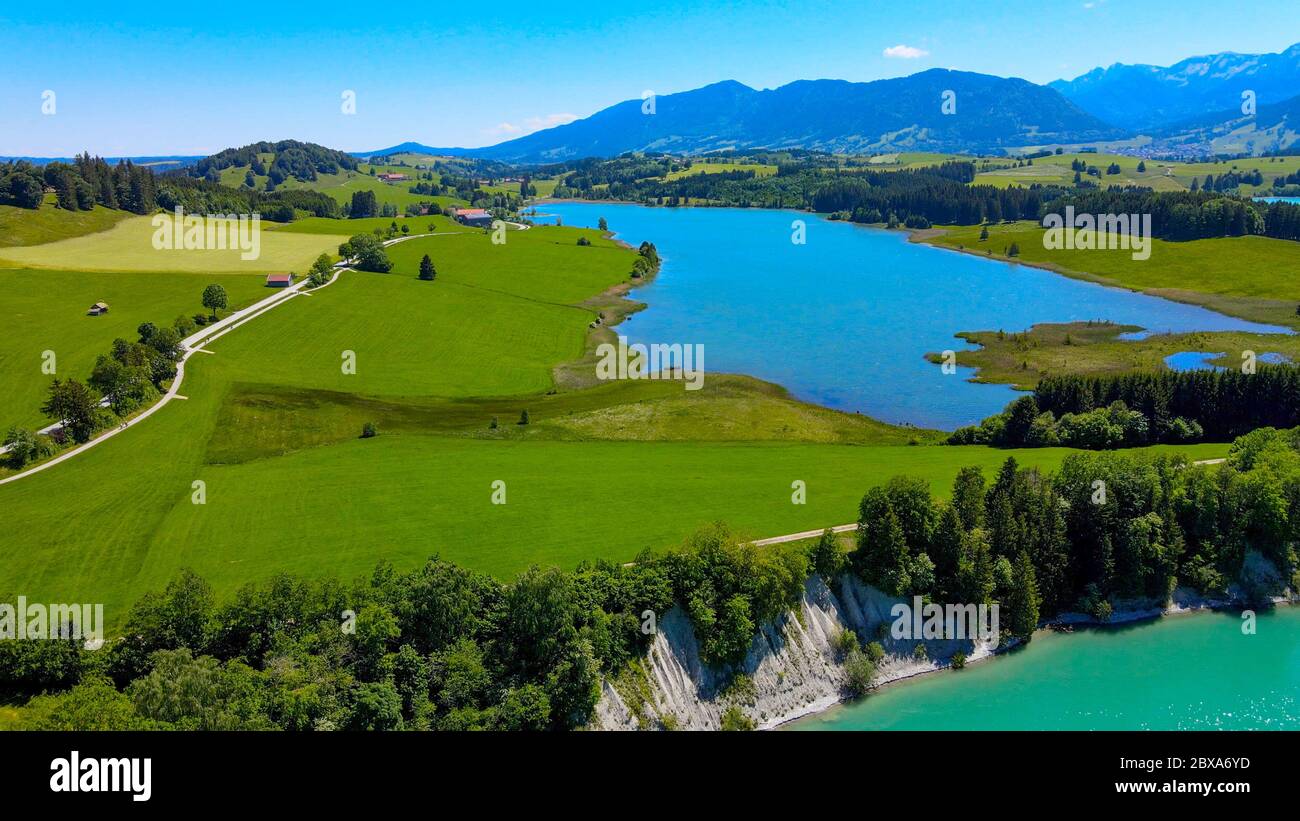 Aerial view over Lake Forggensee at the city of Fuessen in Germany ...