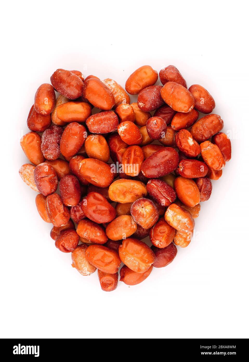 Organic dried ripe dates in heart symbol isolated on white background ...