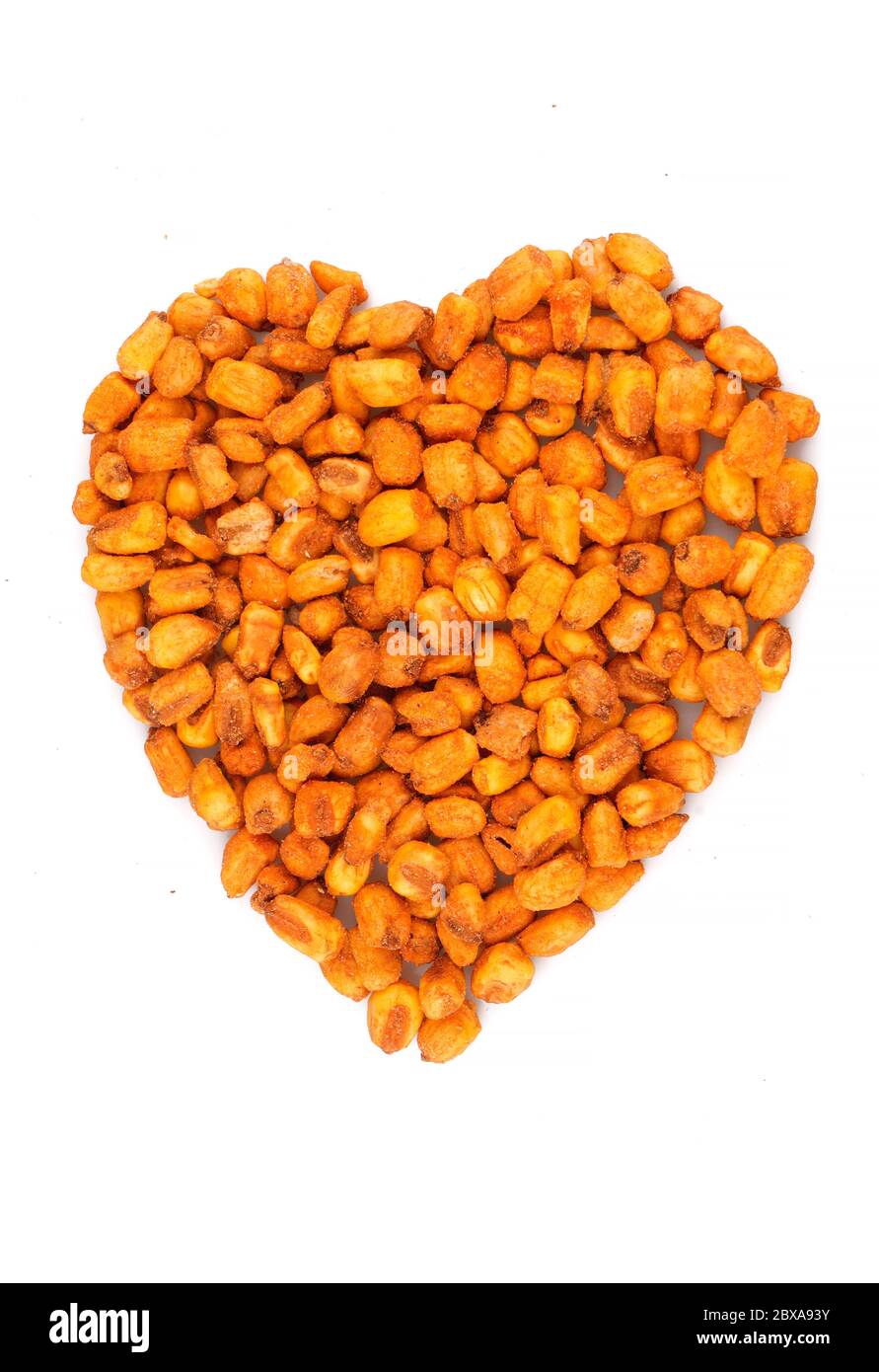 Organic Salted roasted corn in heart symbol isolated on white ...