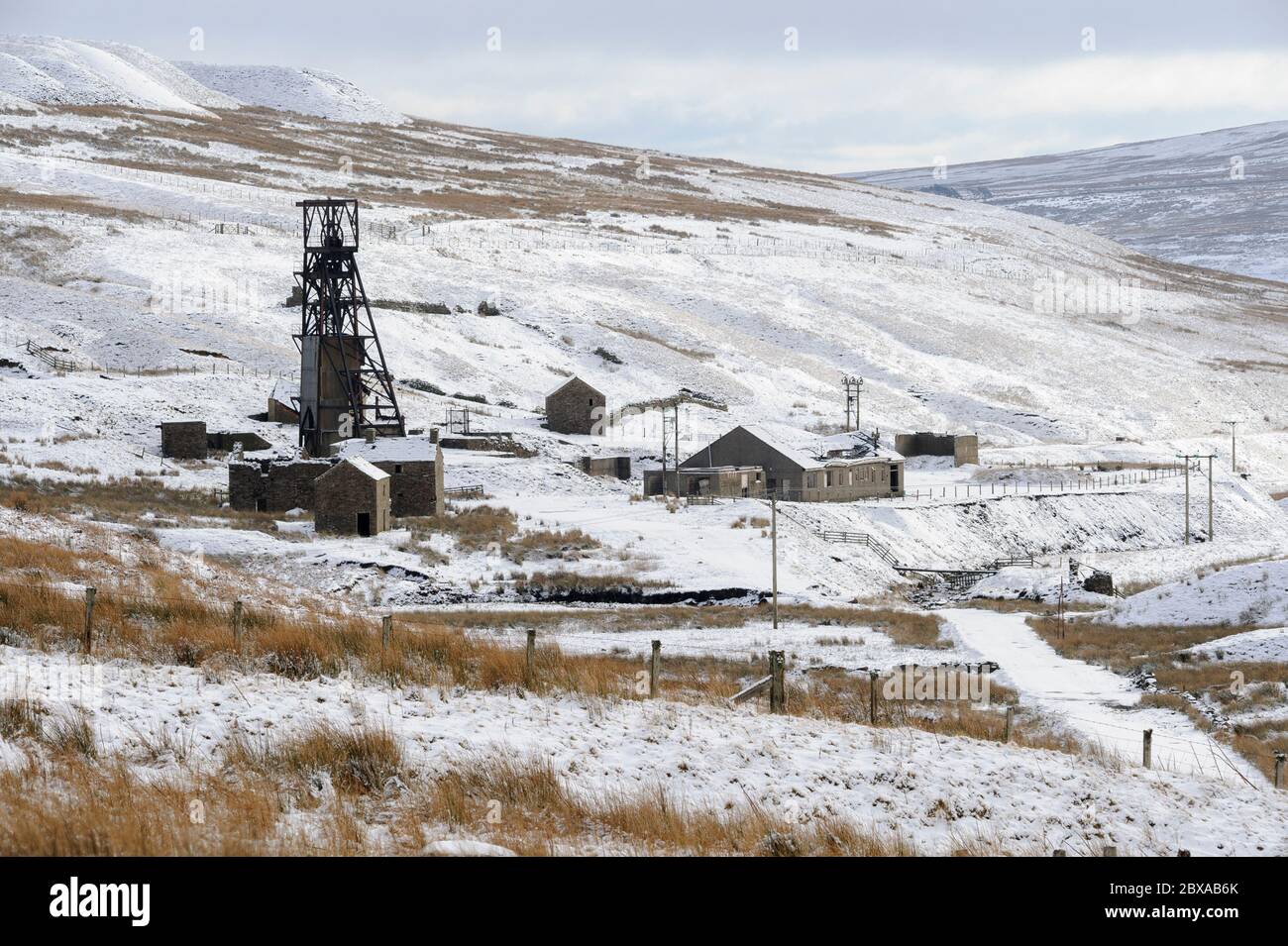 Winter view of Groverake fluorspar mine (now disused) in the snow ...